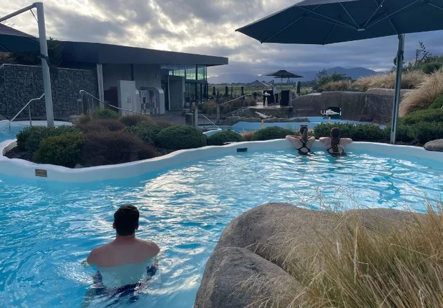 Swimmers seek the heat in wet summer